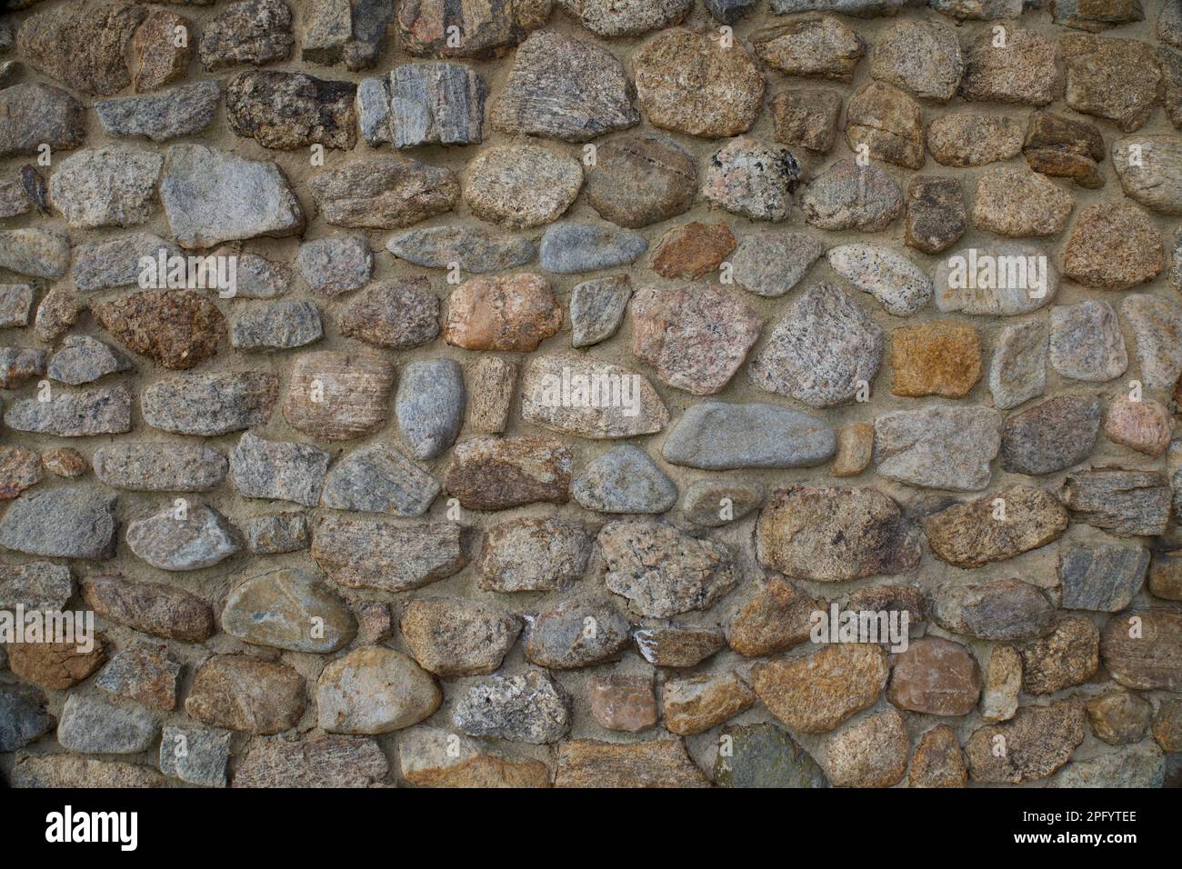 Texture of a stone wall. Part of rock wall as a background or texture ...