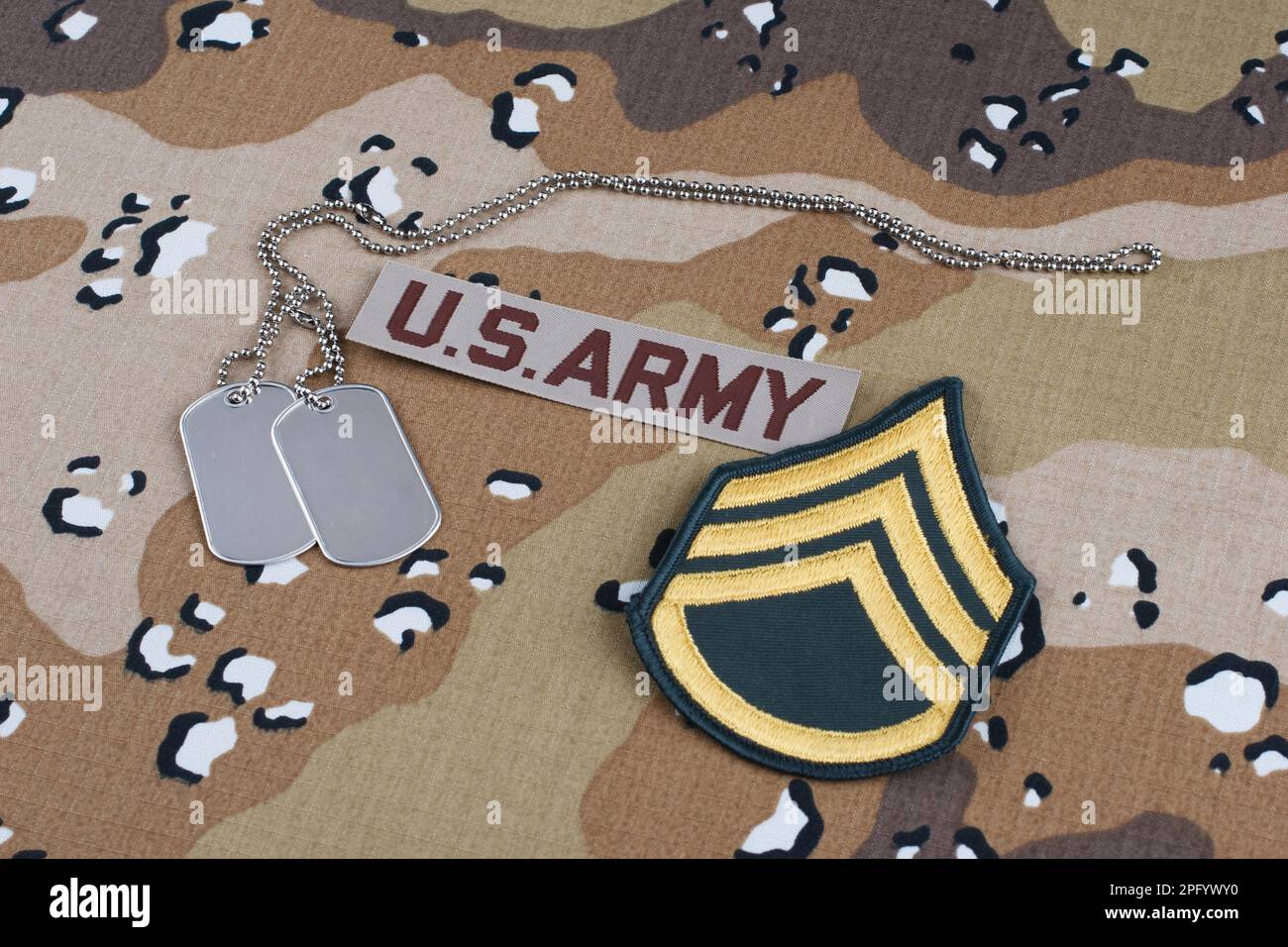 US ARMY staff sergeant rank patch and dog tags on Desert Battle Dress ...