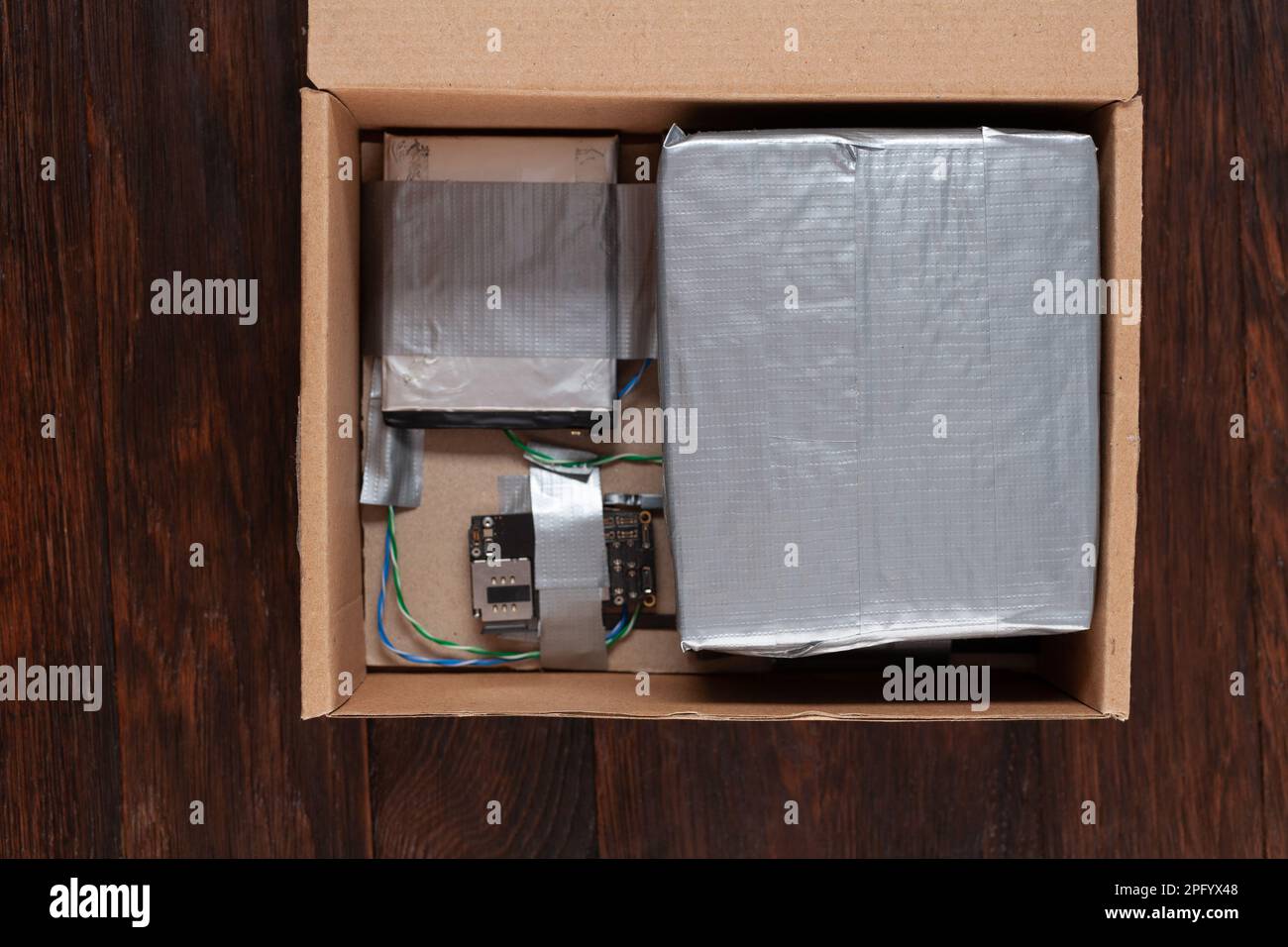 Hand made bomb with c4 and cell phone module in a cardboard box Stock ...