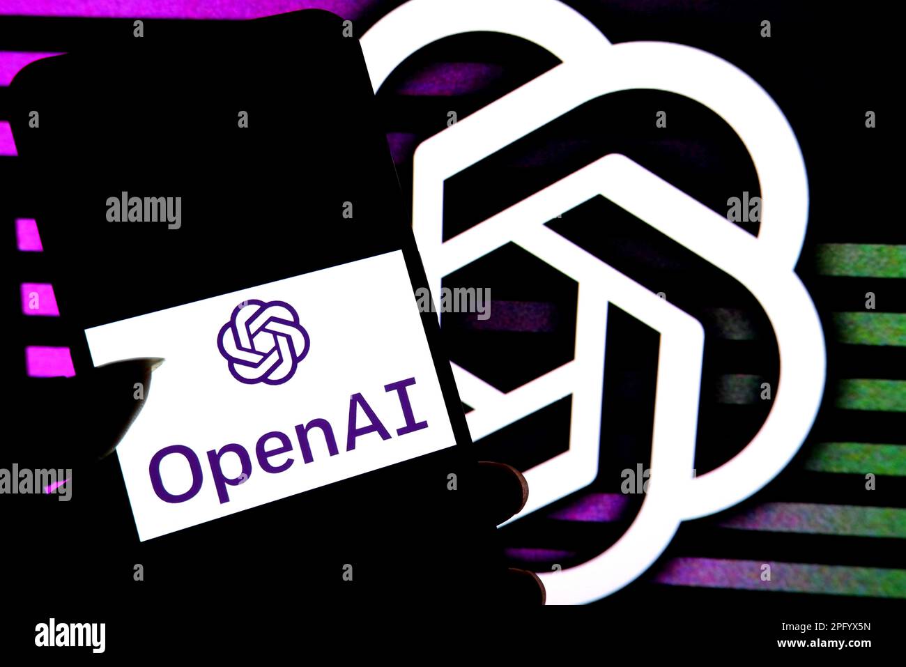 In this photo illustration, an Open AI logo is seen displayed on a ...