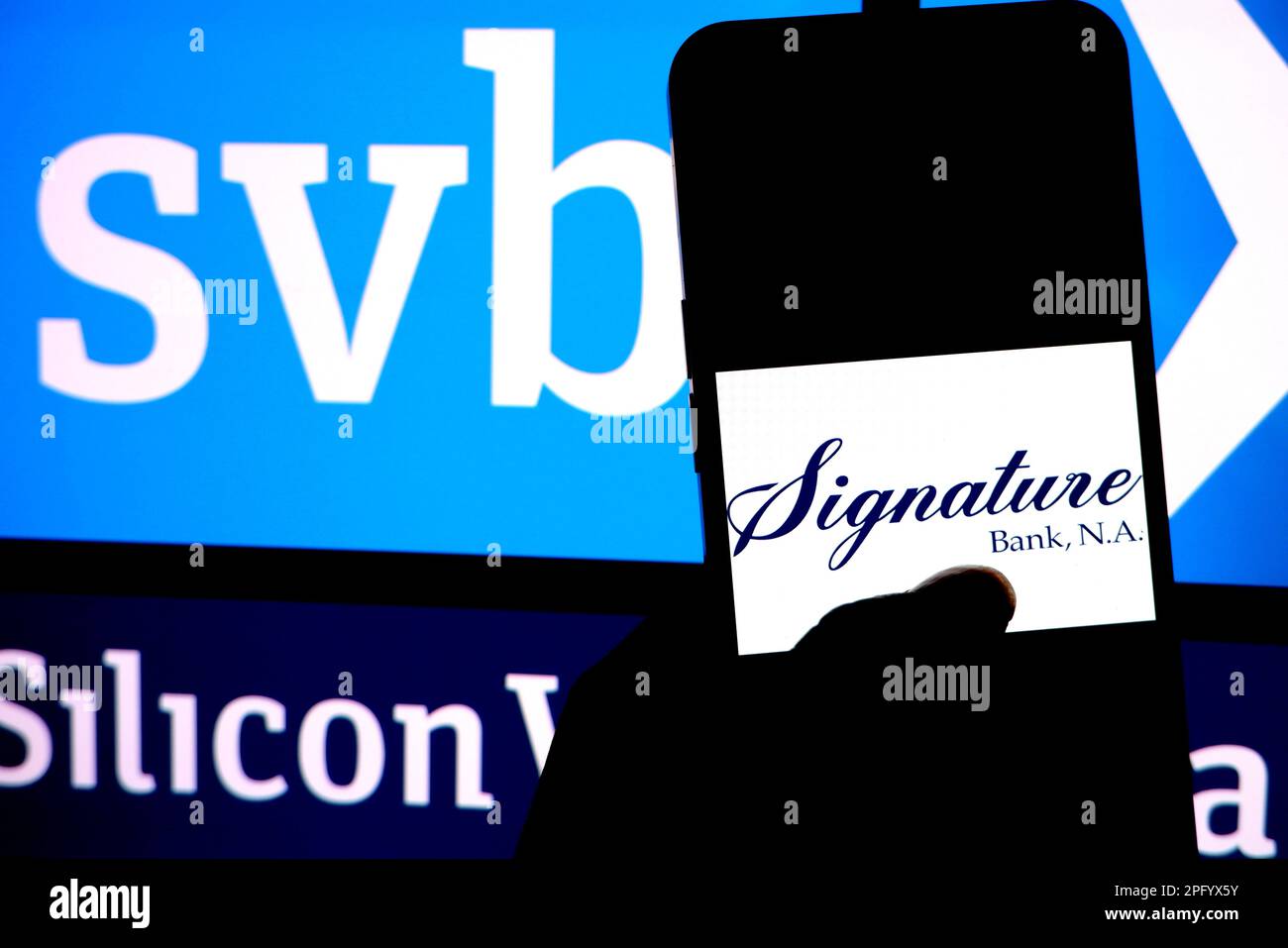 In this photo illustration, a Signature bank logo is displayed on a ...