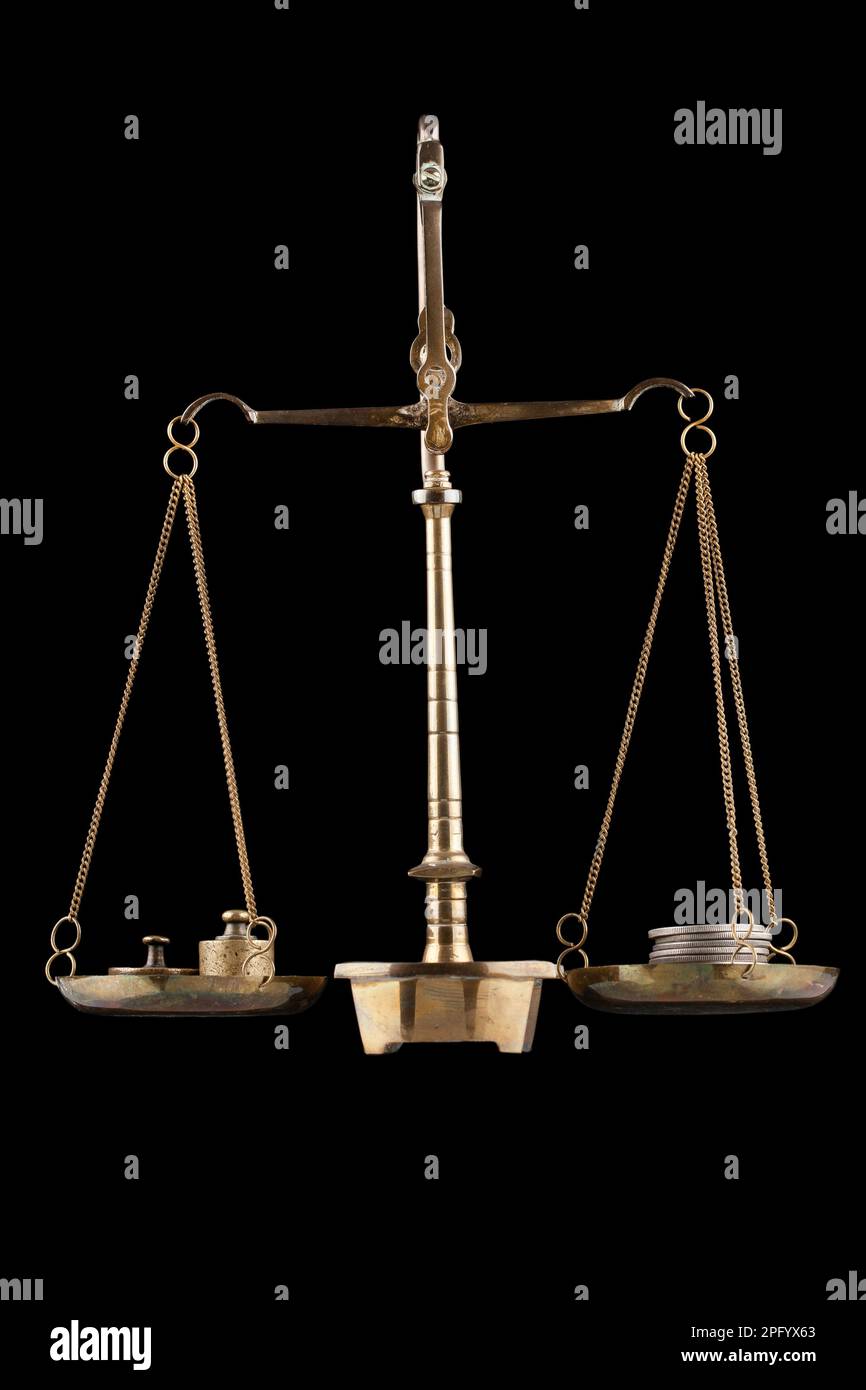Bronze traditional balance scale set with weights and silver coins on ...