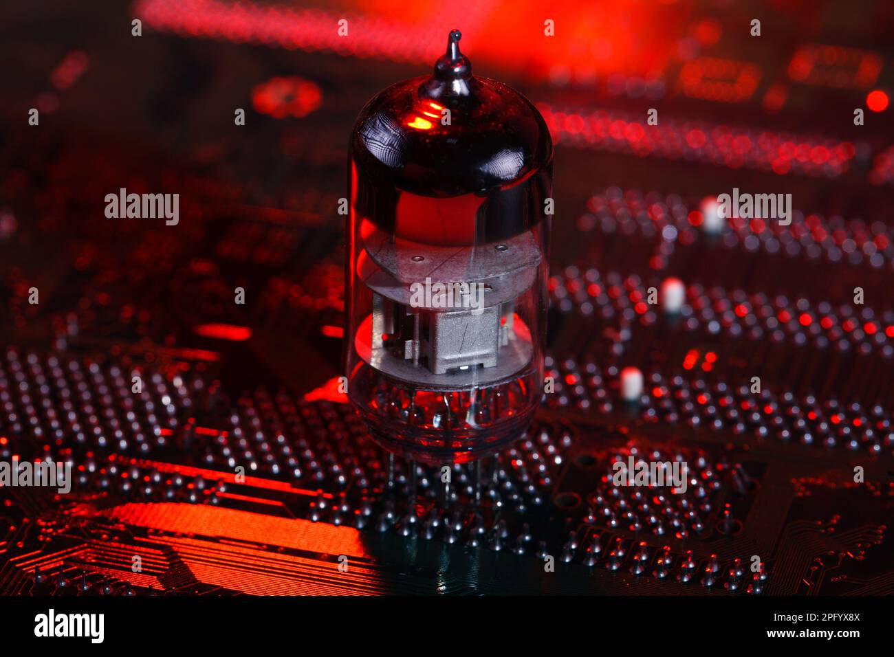 Electronic vacuum tube on circuit board on red anode light Stock Photo ...