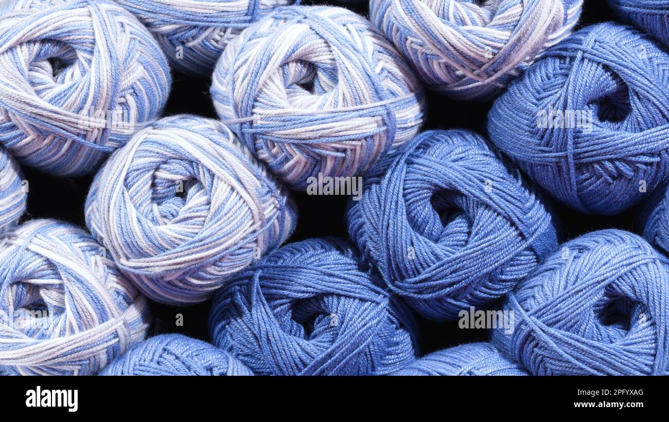 Balls of blue wool, assortment of yarn on display in the store. Sale of ...