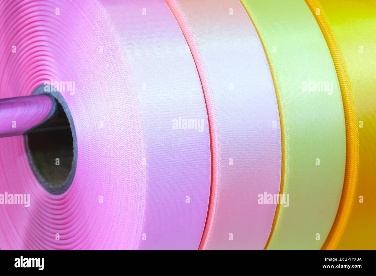 a set of a number of coils of satin ribbons in different colors for the ...