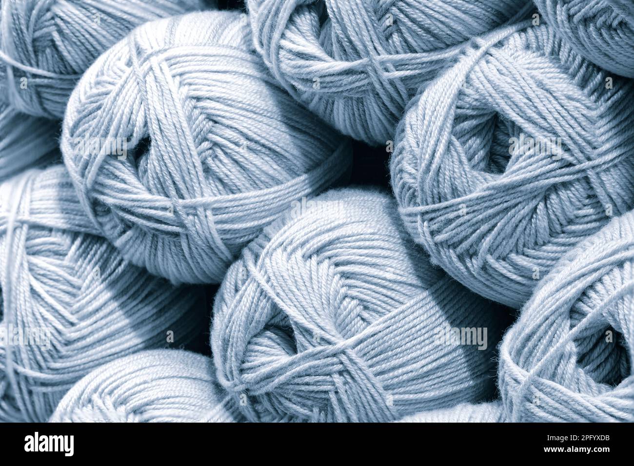 Balls of blue wool, assortment of yarn on display in the store. Sale of ...