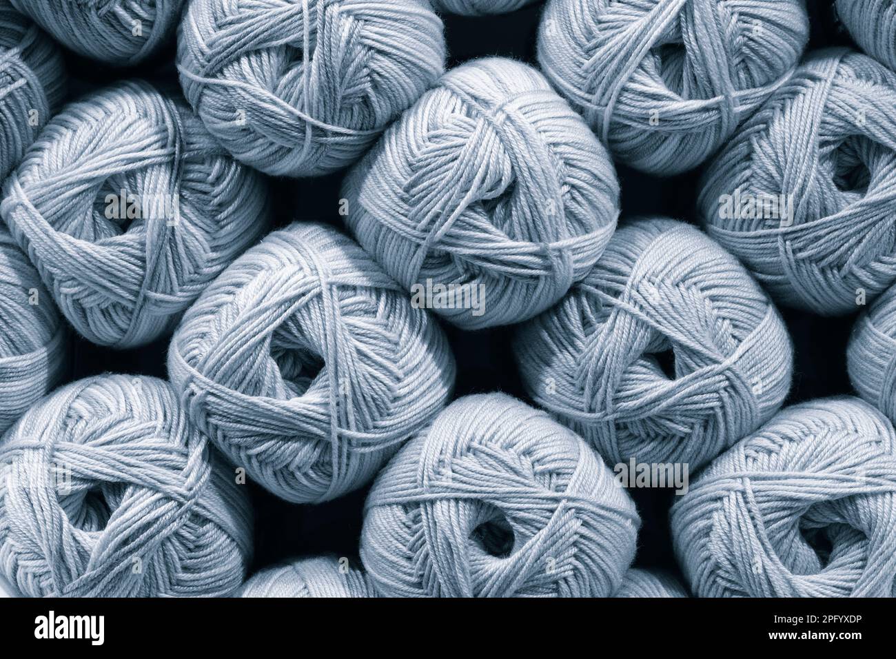 Balls of blue wool, assortment of yarn on display in the store. Sale of ...