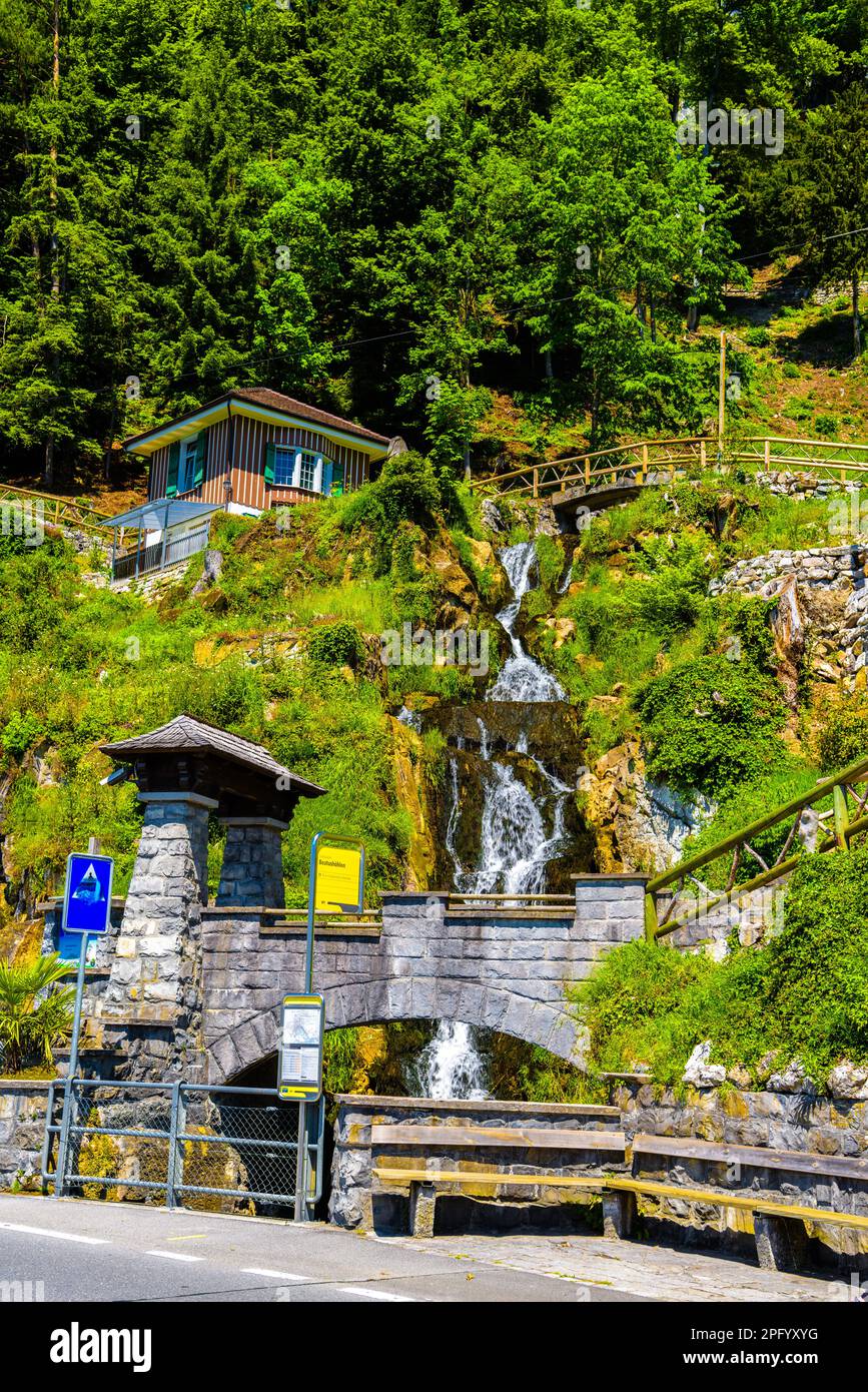 Waterfall on the cliff near Lake Thun, Thunersee in Bern, Switzerland ...