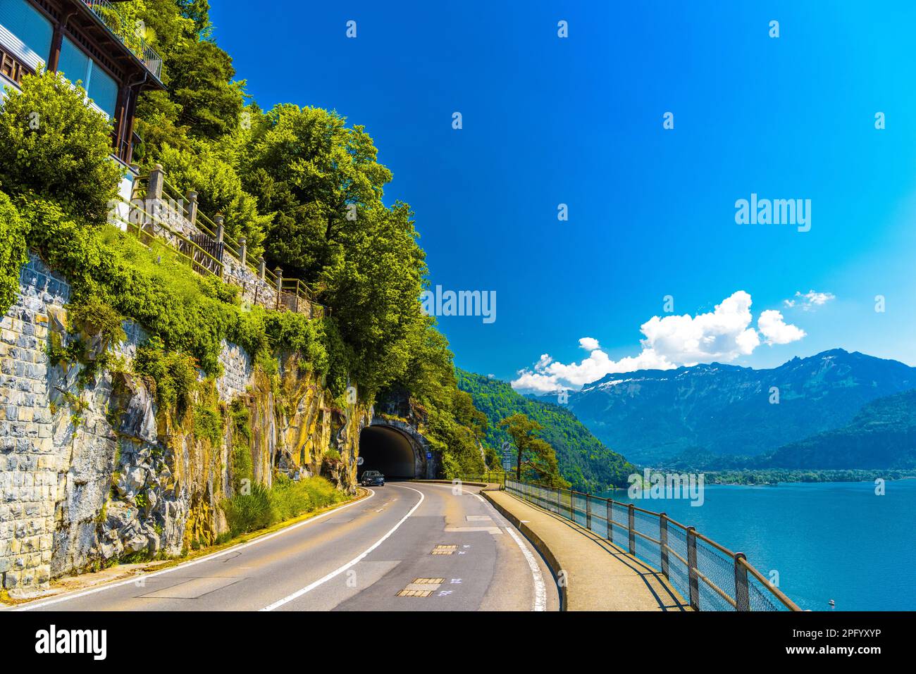 Lake Thun, road and tunnel near mountains, Thunersee Bern Switzerland ...