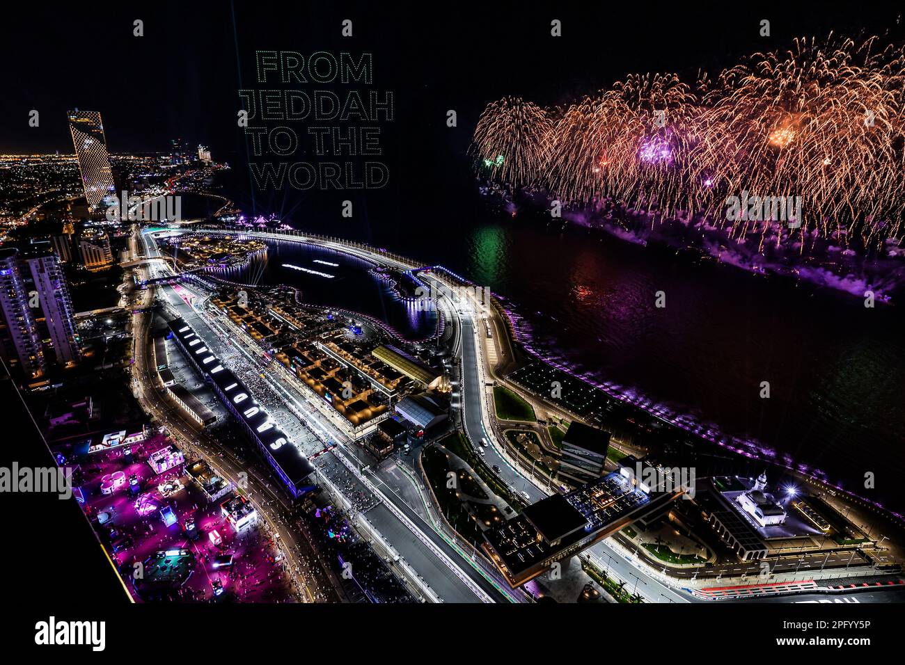 Drone show and fireworks over the starting grid seen from the sky ...