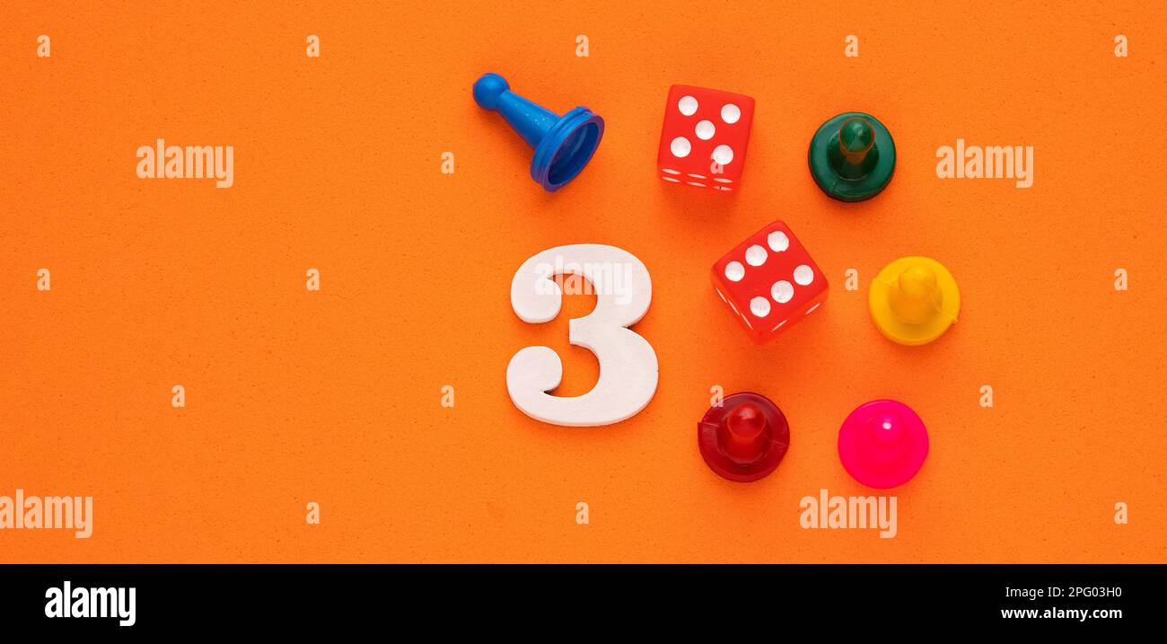 Number 3 with dice and board game pieces - Orange eva rubber background ...
