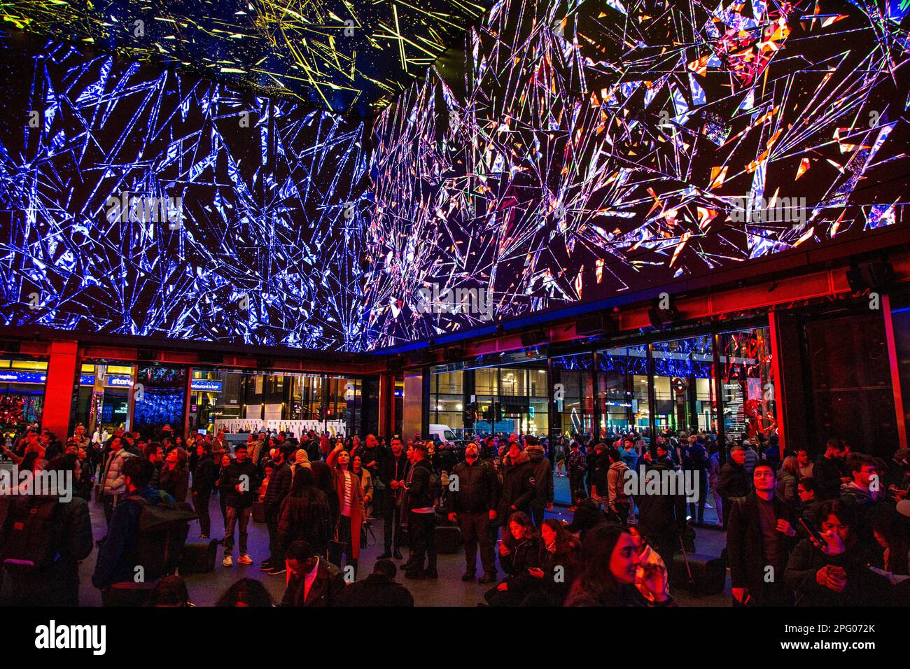 People looking at 'A Step Beyond' by light artist Rupert Newman at the ...