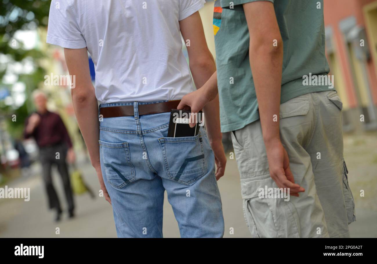 Symbol photo, pickpocketing Stock Photo - Alamy