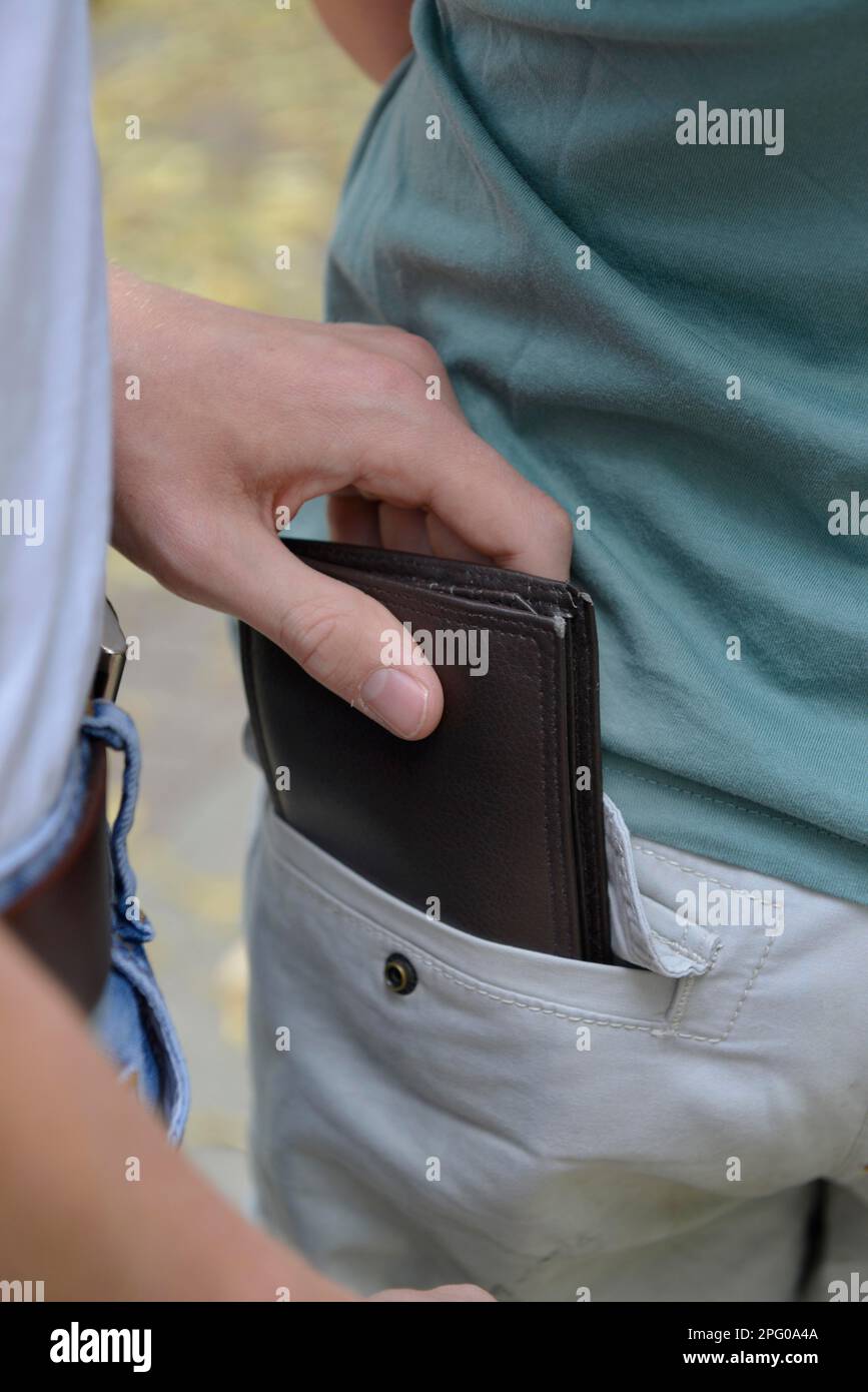 Symbol photo, pickpocketing Stock Photo - Alamy