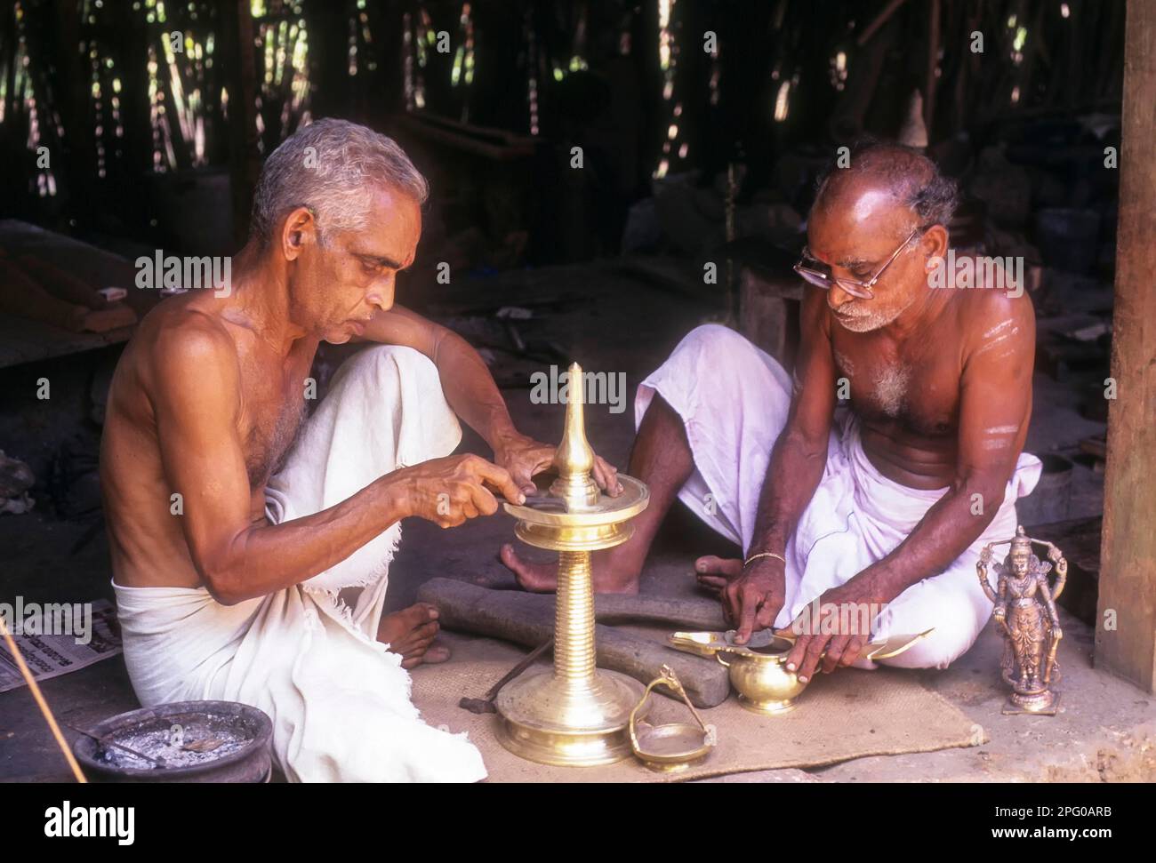Men making oil lamp, Kerala, India Stock Photo - Alamy