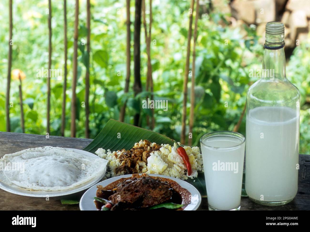 Toddy or kallu, Kappa or Tapioca, Appam and fish curry in Kuttanad, kerala, India, Asia Stock ...