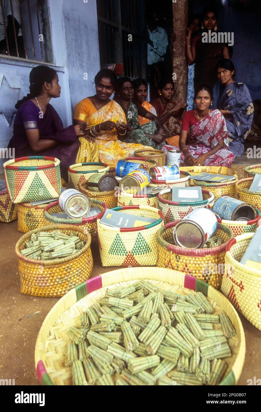 Beedi workers waiting for deliver their rolled beedis to the company ...