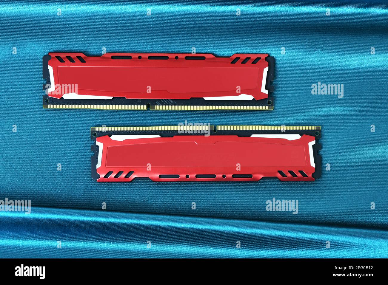 Two ddr4 ram memory modules with red metal diffusers on a shiny green ... Two ddr4 ram memory modules with red metal diffusers on a shiny green ...