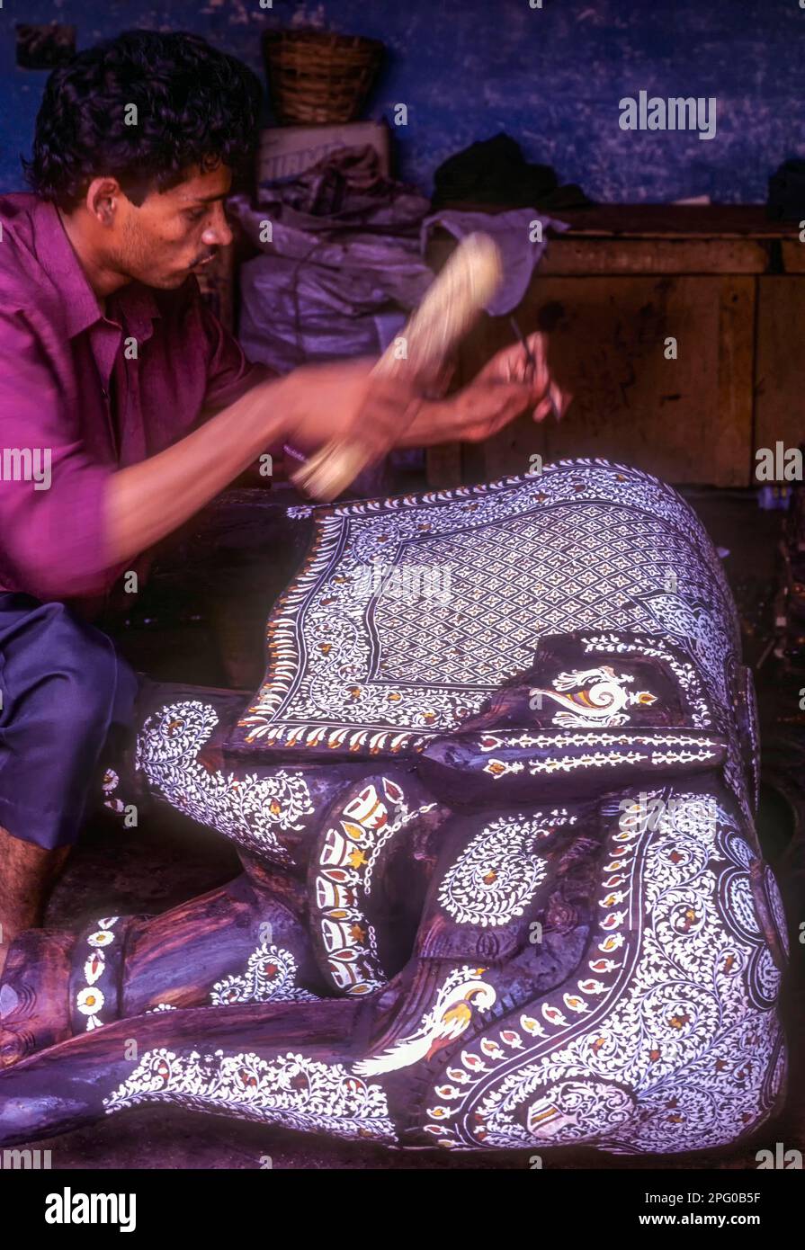 An artisan making inlay work a rosewood elephant at Mysore, Karnataka ...