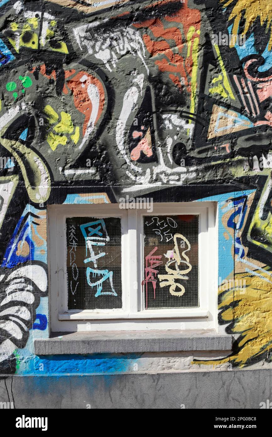 Window with colourful graffiti mural on a house wall, Bremen, Germany ...