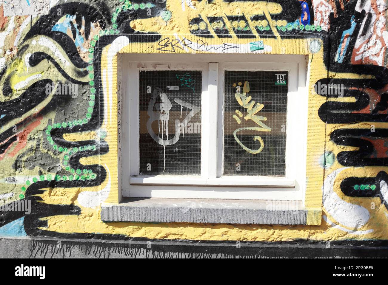 Window with colourful graffiti mural on a house wall, Bremen, Germany ...