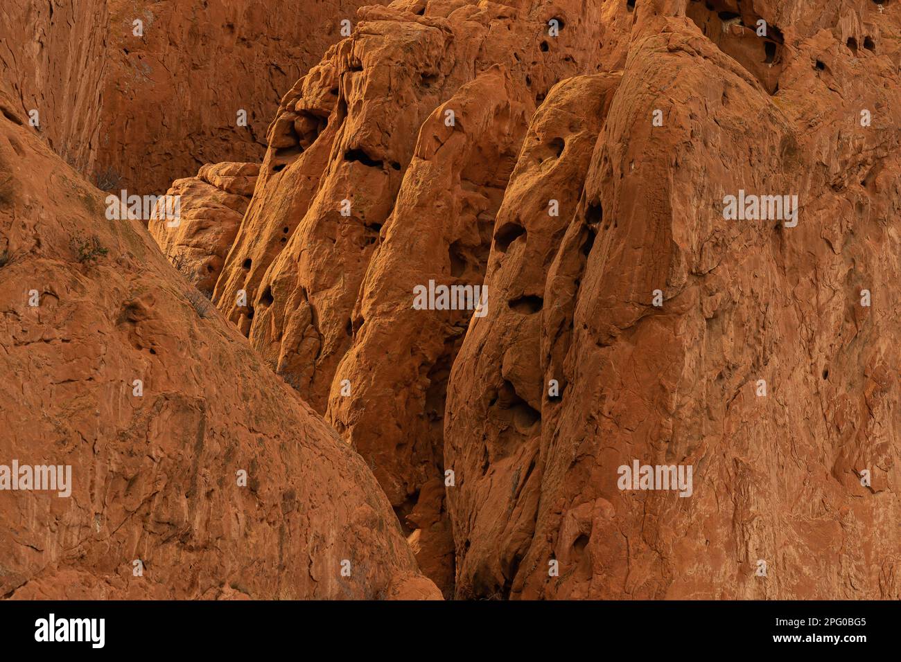 Red sandstone rock features, showing interesting texture, pits, pock ...