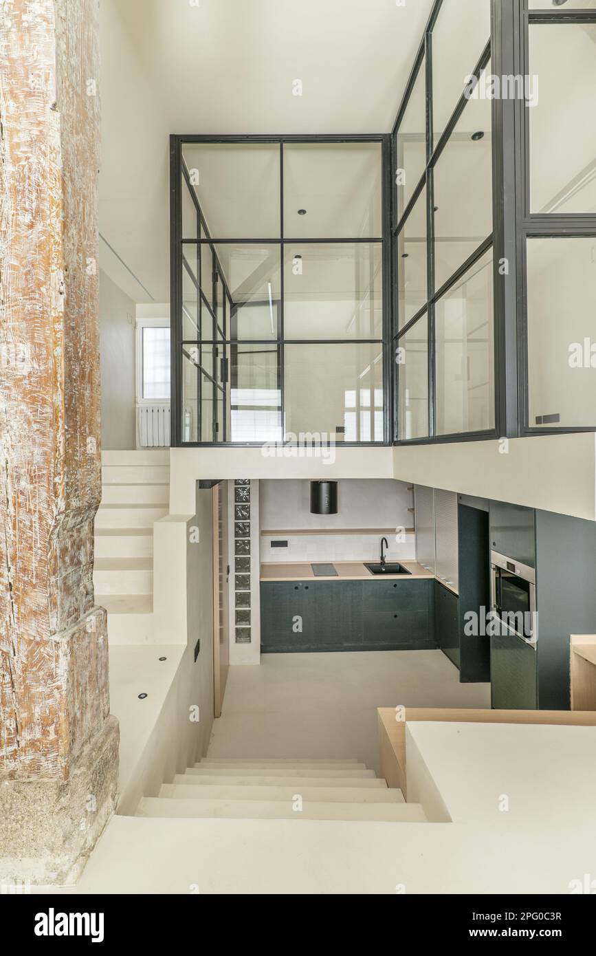 Loft house with two three heights with stairs down to the kitchen and ...