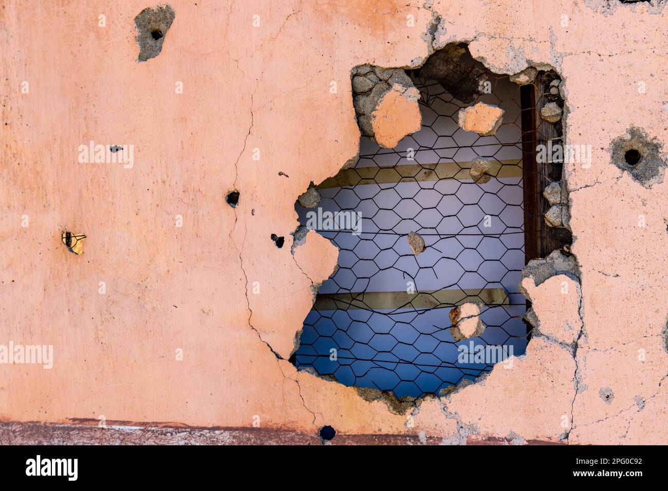 Chicken wire and adobe wall in the desert Stock Photo - Alamy