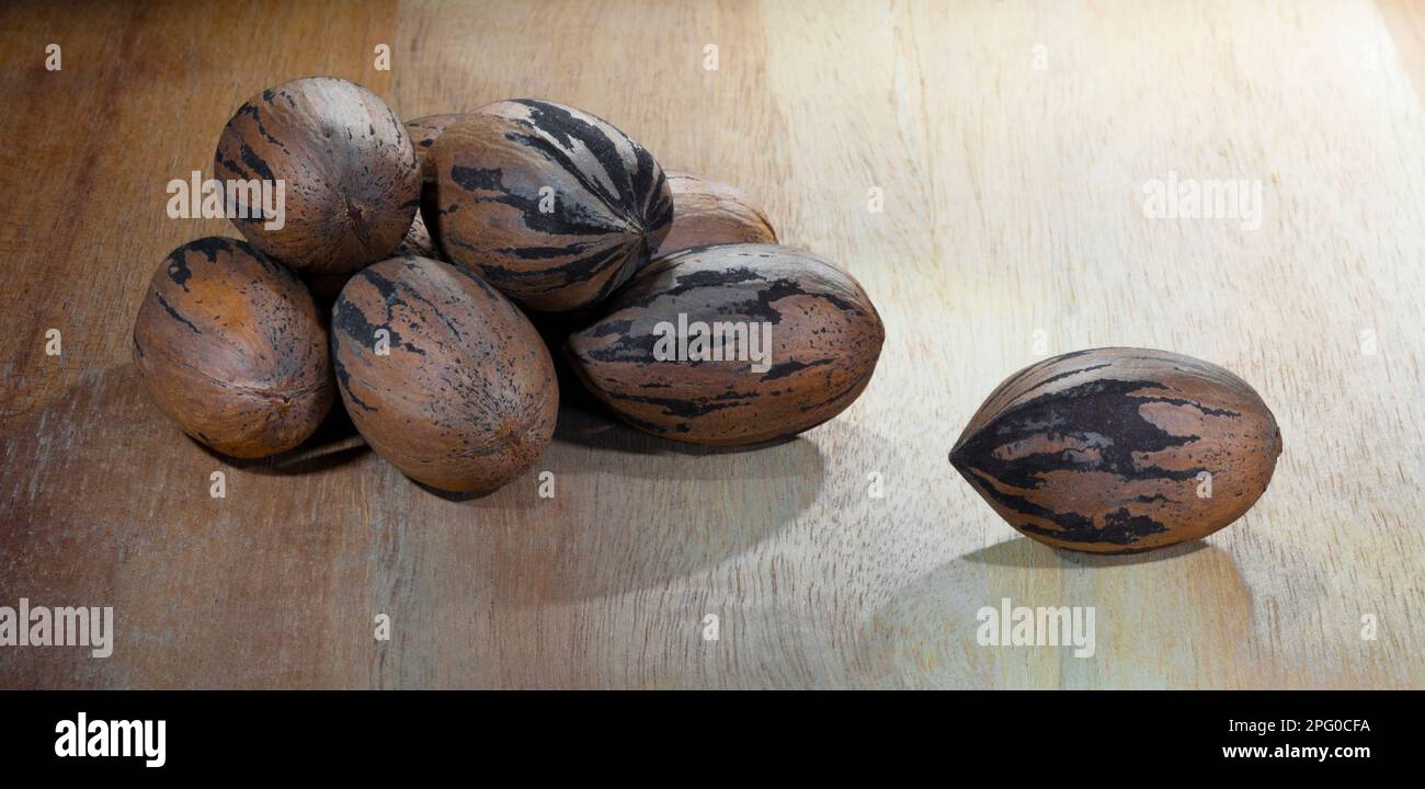 Pecans still in the shell hi-res stock photography and images - Alamy