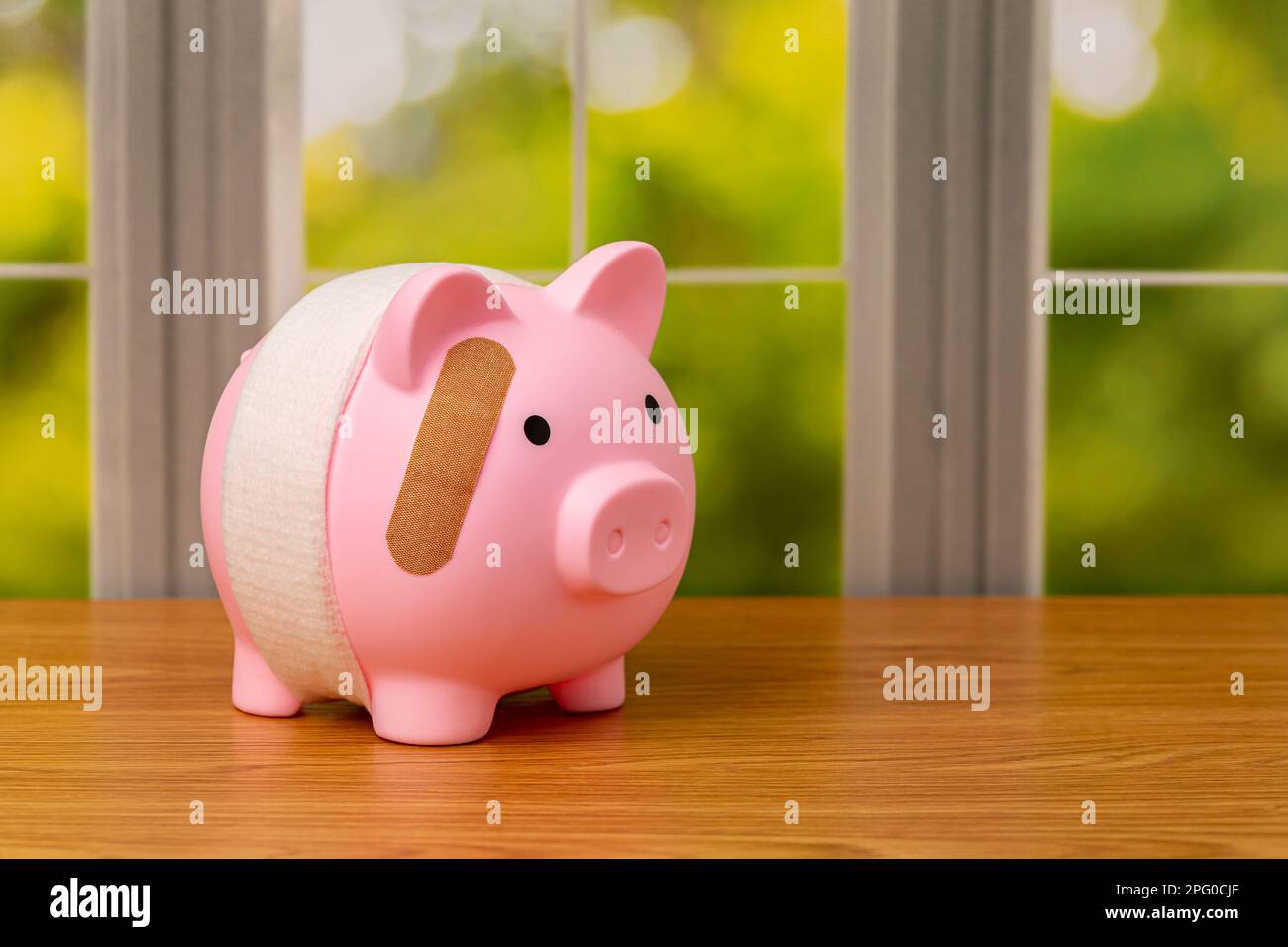 Piggy bank with bandage. Retirement, bank failure, financial health and ...