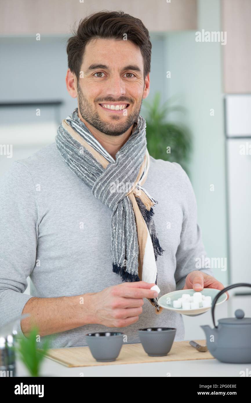 Man puts sugar in cup hi-res stock photography and images - Alamy