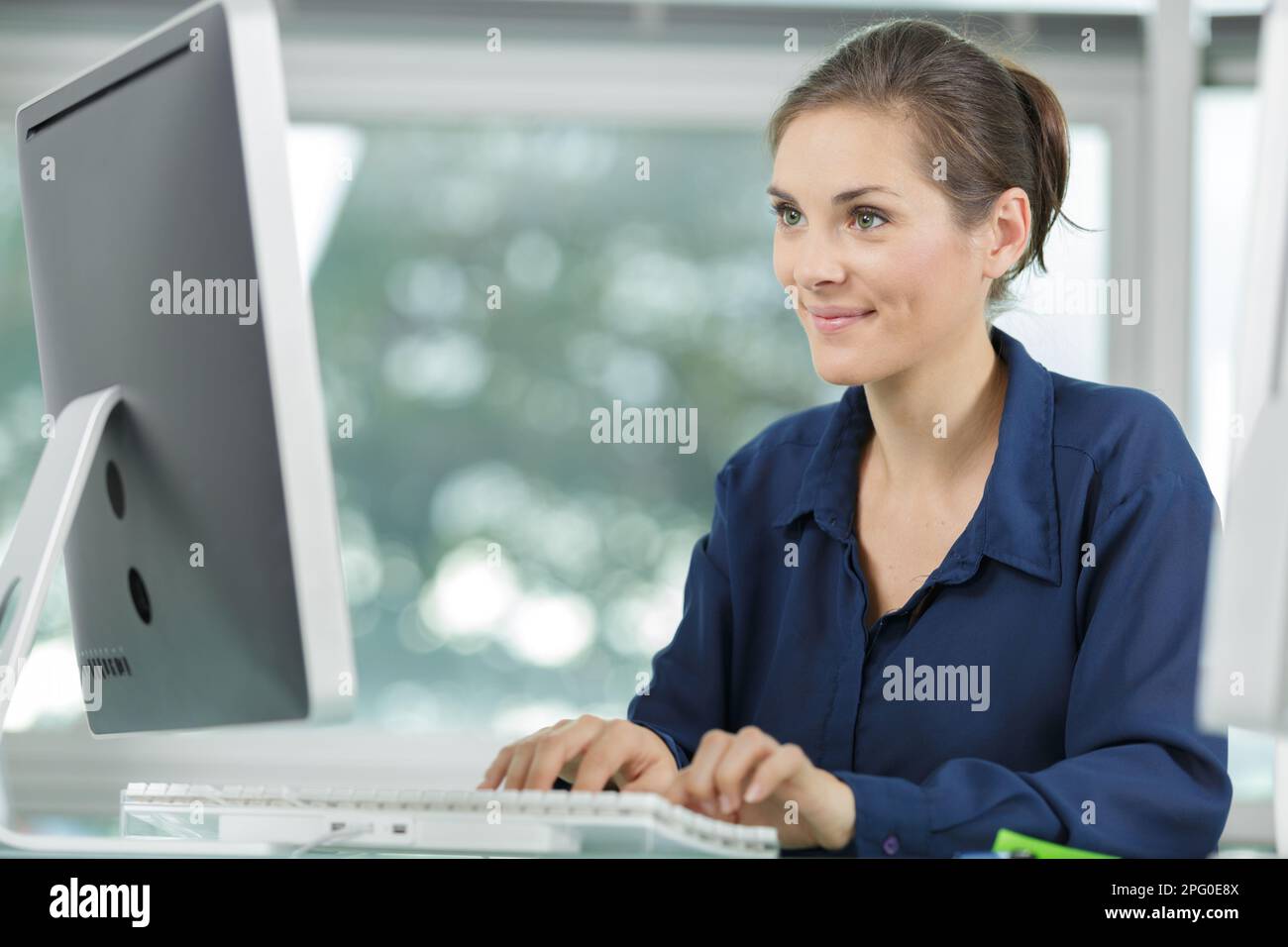 young business woman with computer in the office Stock Photo - Alamy