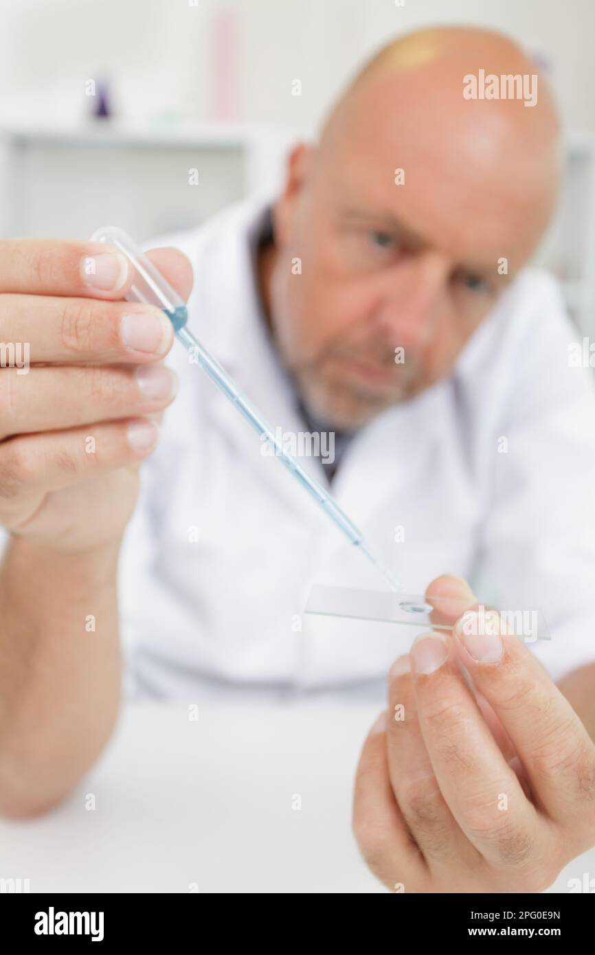 portrait of medical doctor with pipette Stock Photo - Alamy