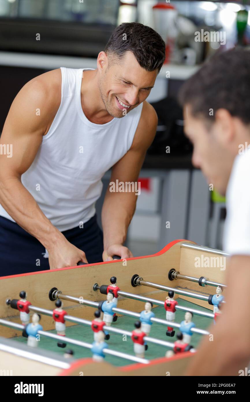 people are playing table football Stock Photo - Alamy