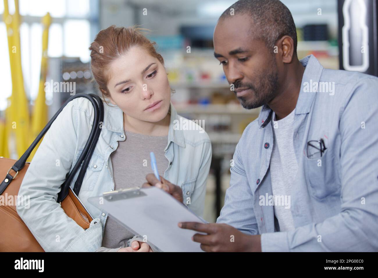 Man woman in overalls discussing hi-res stock photography and images ...