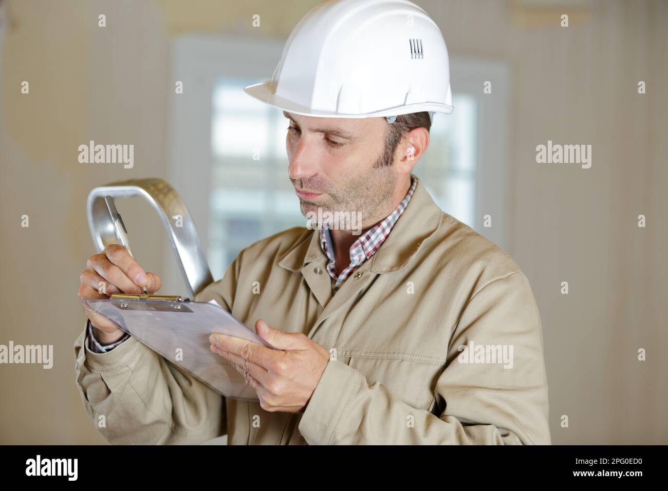 Male architect clipboard pencil hi-res stock photography and images - Alamy