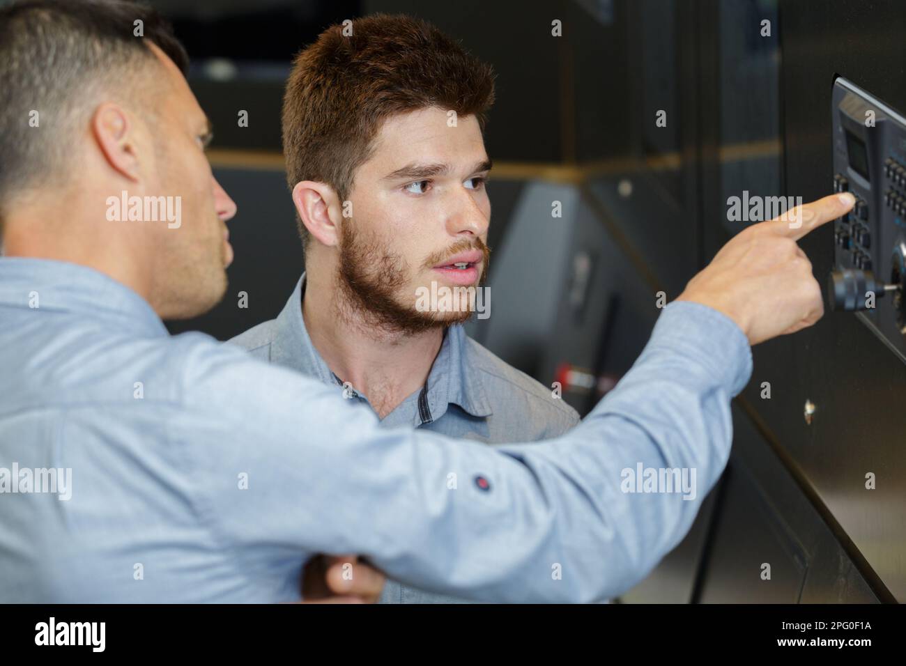 learning to use a machine Stock Photo - Alamy