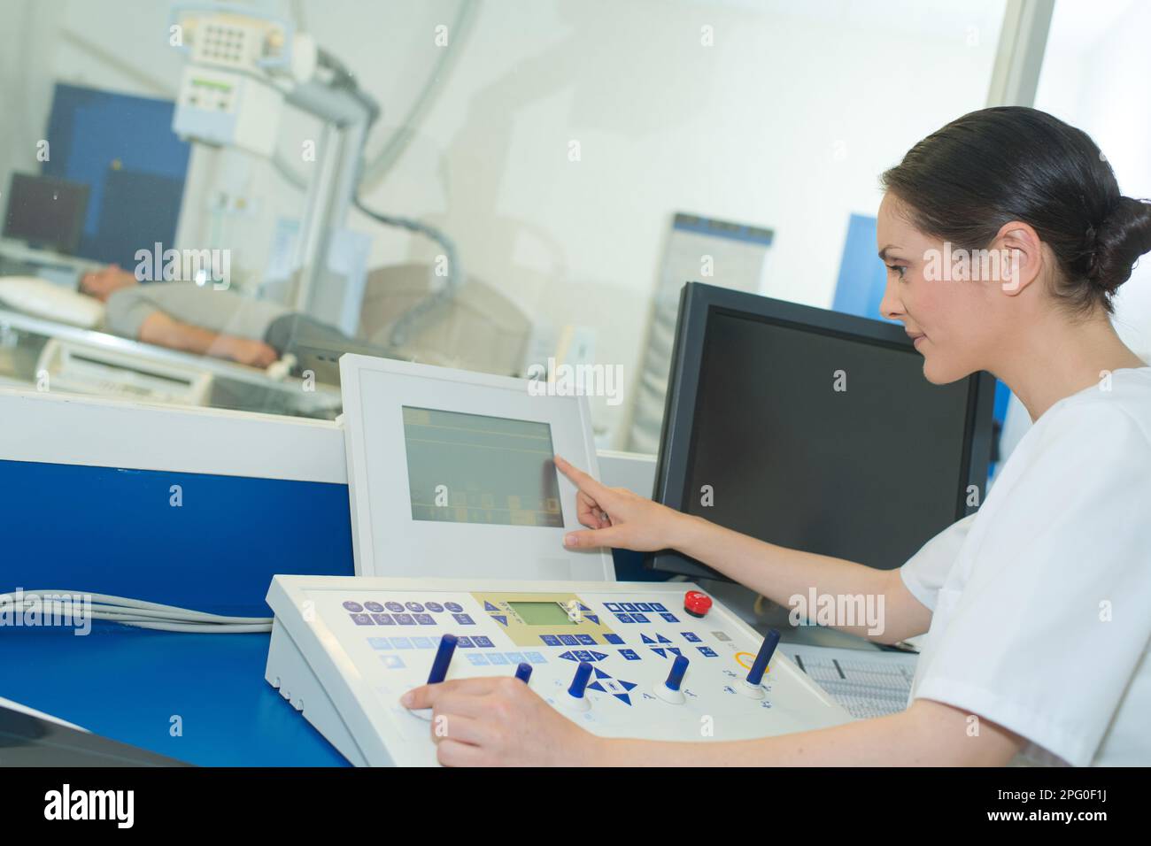 radiologist operating and analysing scanner equipment Stock Photo - Alamy