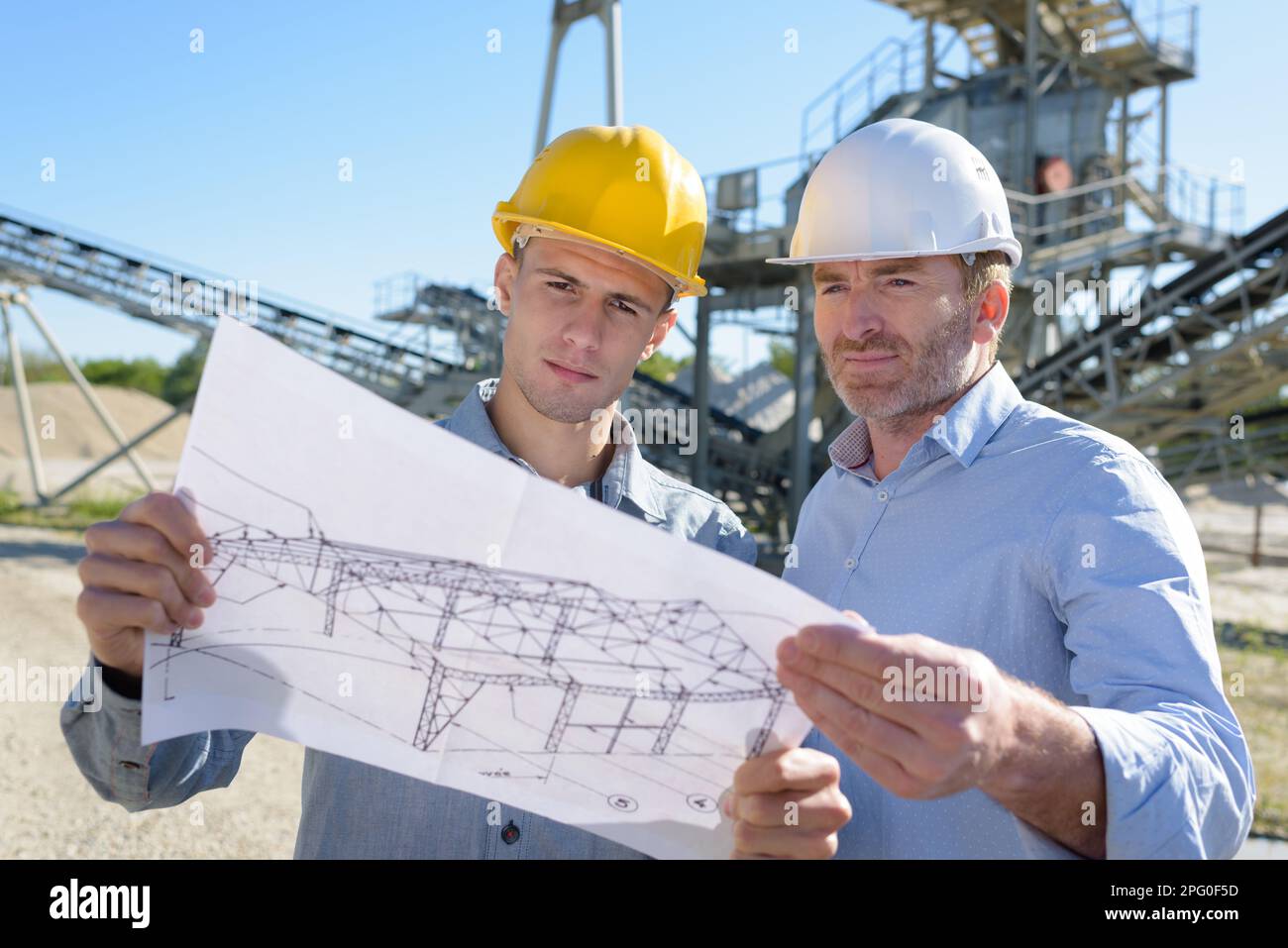 two workers working are outside Stock Photo - Alamy