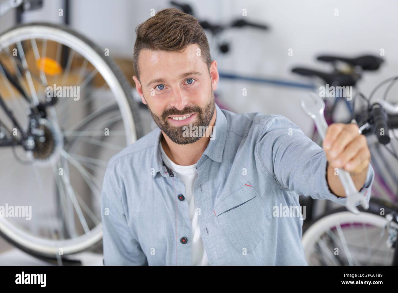 happy man at a bicycle store Stock Photo - Alamy