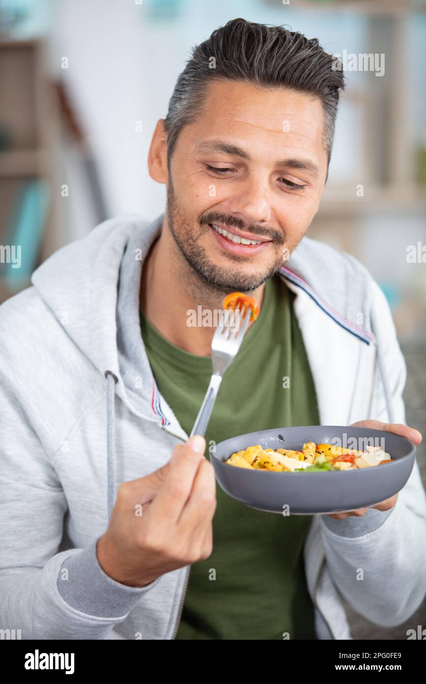 man enjoying a healthy salad lunch Stock Photo - Alamy