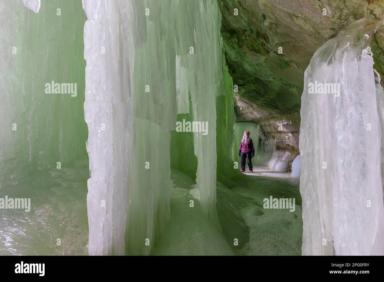 Karen Rentz behind the spectacular ice formations of Eben Ice Caves ...