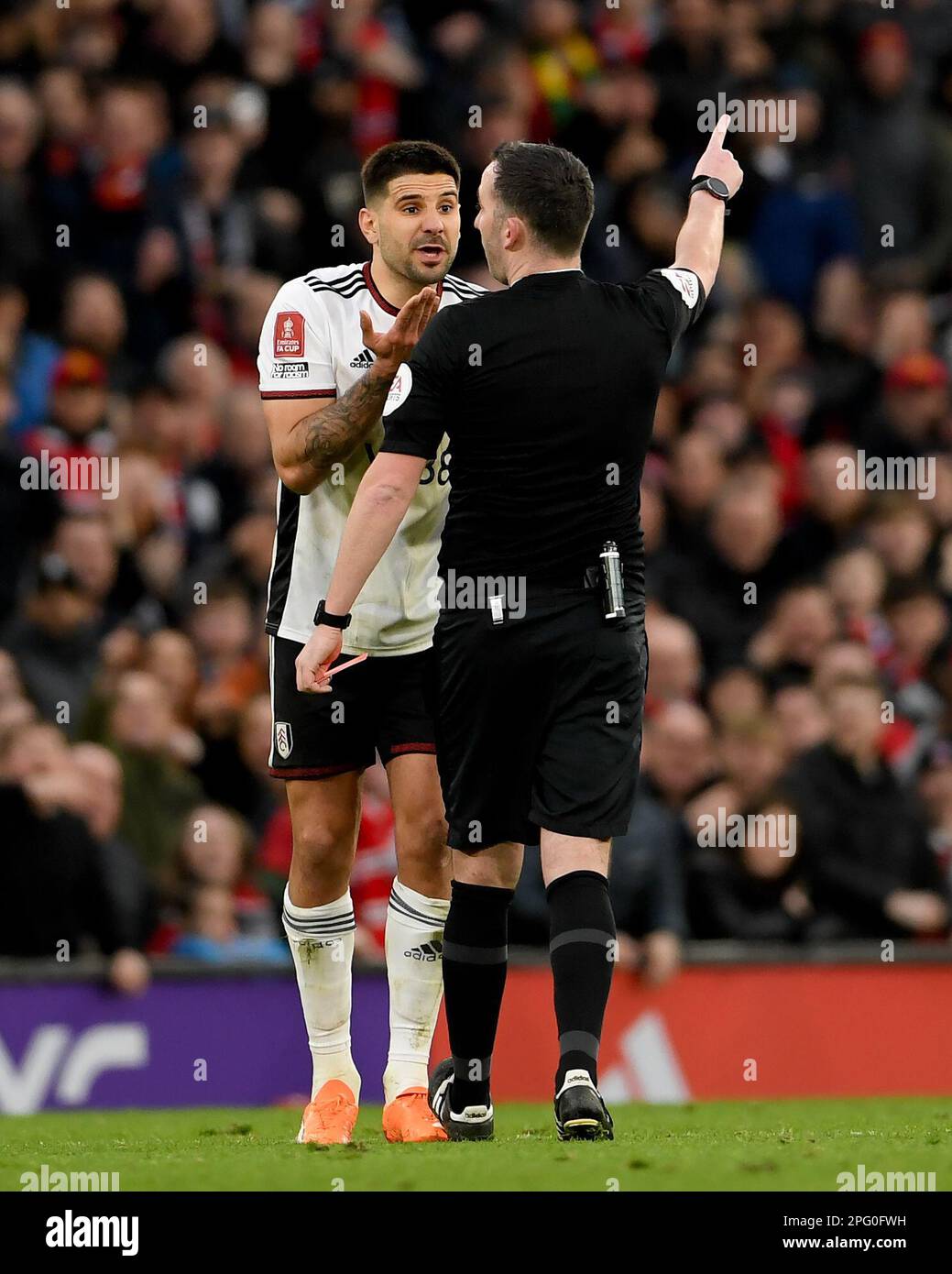 Manchester, UK. 19th Mar, 2023. Referee Chris Kavanagh gives Aleksandar ...
