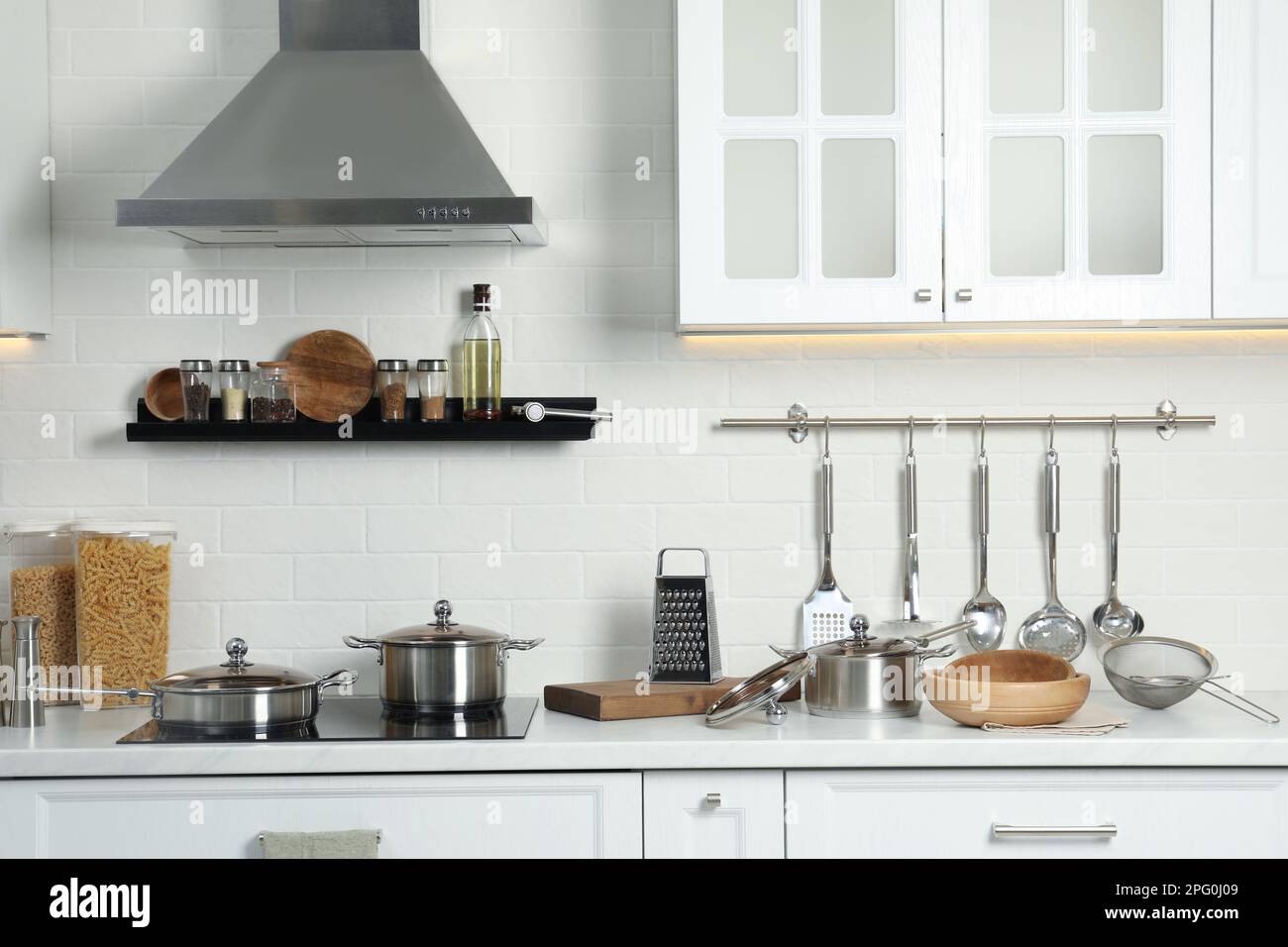Countertop with different cooking utensils in kitchen Stock Photo - Alamy