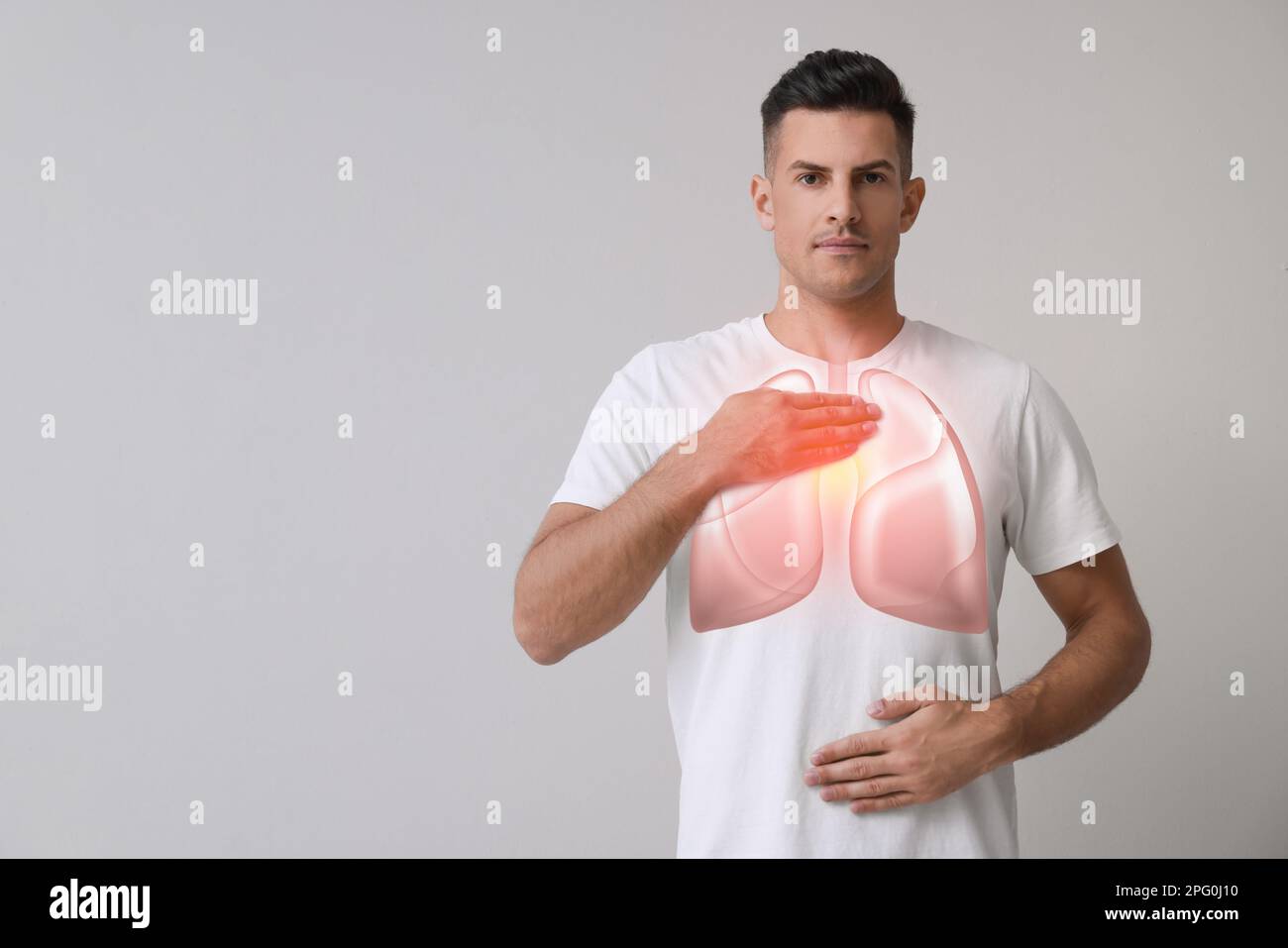 Handsome man holding hands near chest with illustration of lungs on ...