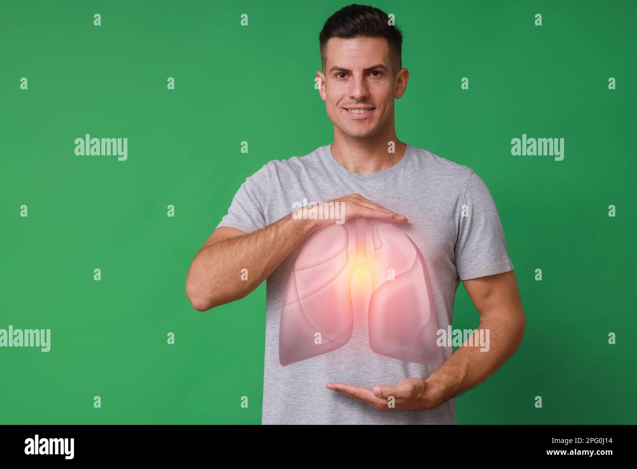 Handsome man holding hands near chest with illustration of lungs on ...