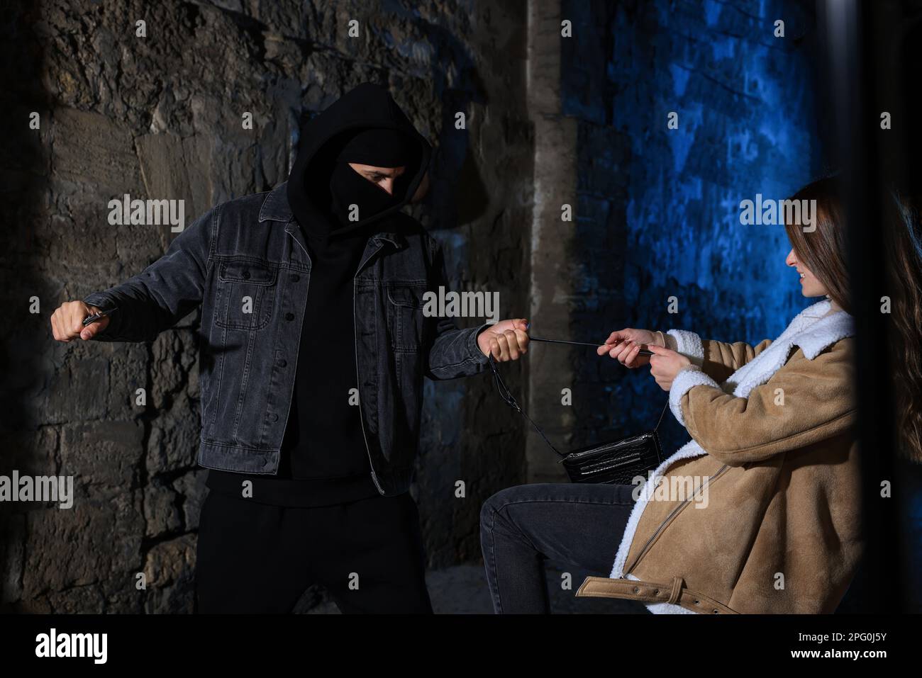 Woman Fighting With Thief While He Trying To Steal Her Bag In Alley At