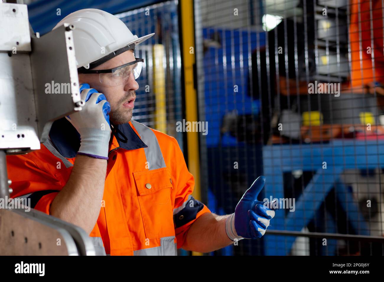 Young caucasian engineer man inspection robot arms technology ...