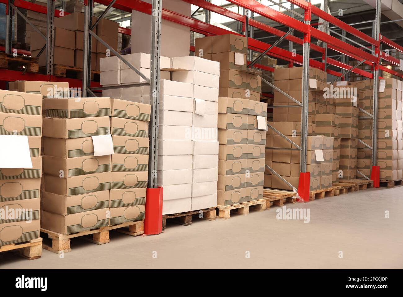 Warehouse with stacks of boxes on wooden pallets. Wholesaling Stock ...