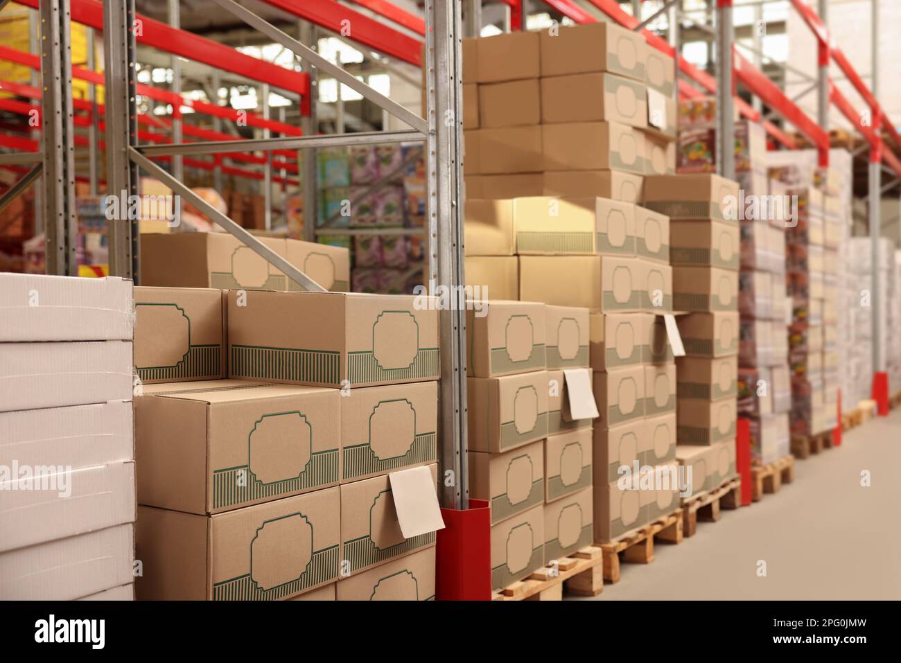 Warehouse with stacks of boxes on wooden pallets. Wholesaling Stock ...